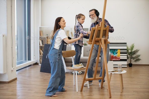 Senior man and females starting art project with dance Stock Photo by ...