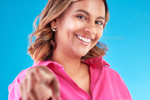 Woman, pointing finger and smile portrait in studio for beauty ...