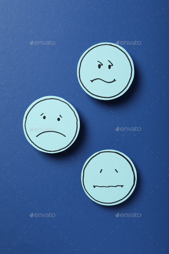 Paper with sad emoji on dark blue background, top view Stock Photo by ...