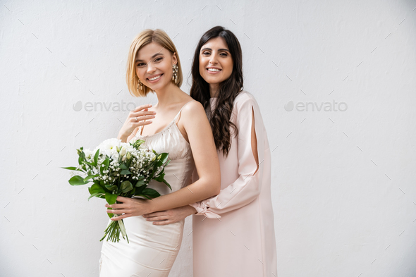 special occasion, cheerful bridesmaid hugging bride, friendship goals ...
