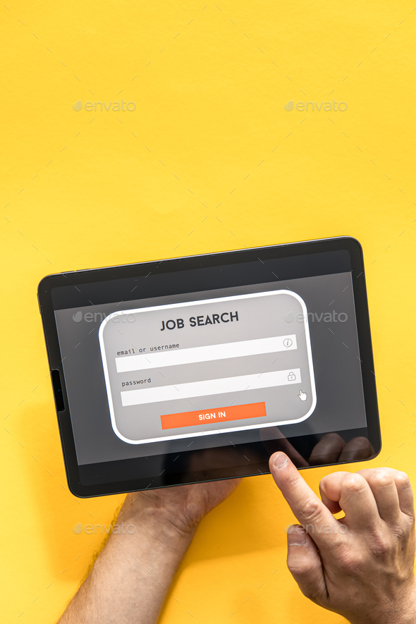 Top view of digital tablet with search job on screen in male hands ...