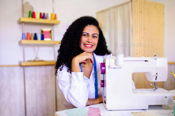 Seamstress Lady Posing At Sewing Machine Crafting Garment At Atelier ...