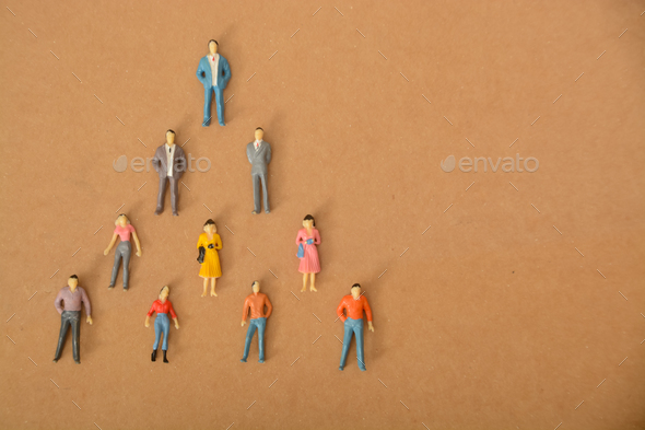 people forming a team in a pyramid shape, the idea of a hierarchical ...
