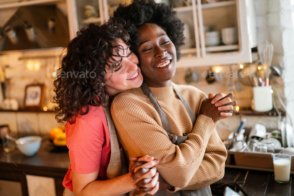 Authentic shot of happy married homosexual female gay couple laughing ...