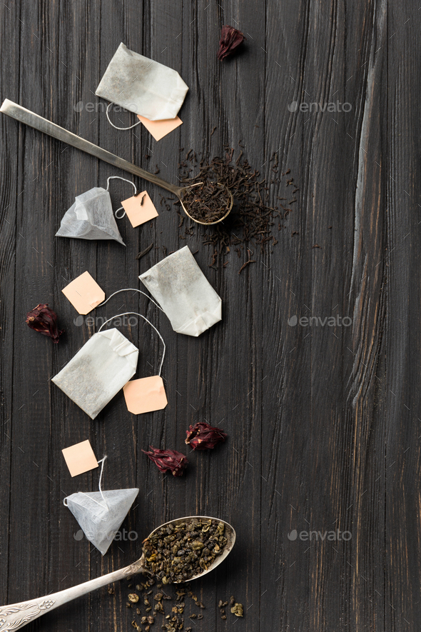 Dry green and black tea, tea bags on a dark background top view. Stock ...