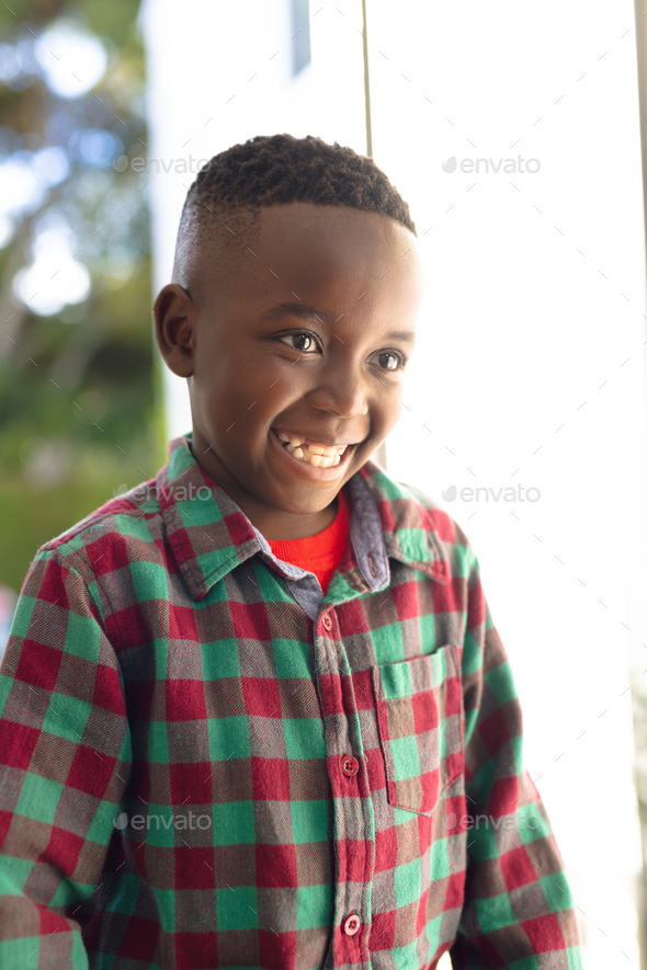 Vertical picture of happy african american boy welcoming somebody ...