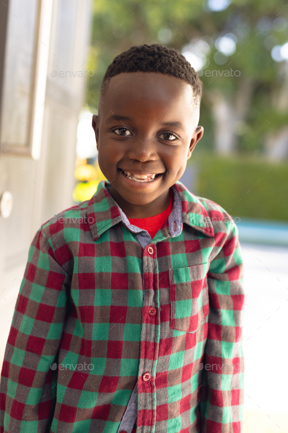 Vertical picture of happy african american boy welcoming somebody ...