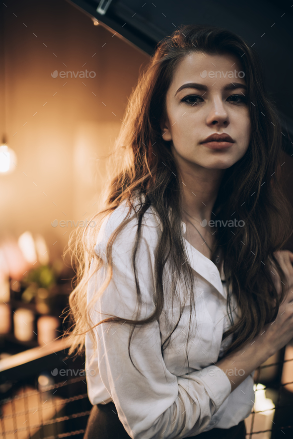 Attractive female lady with elegant style of dressing posing inside ...