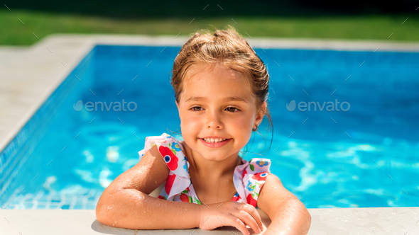 Smiling girl in the pool Stock Photo by frimufilms | PhotoDune
