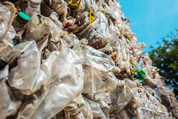 Cube of compressed plastic garbage at a waste recycling factory Stock ...