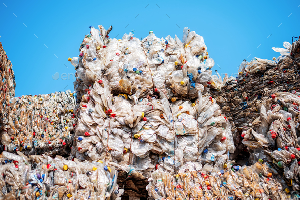 Cubes of compressed plastic garbage at a waste recycling factory Stock ...