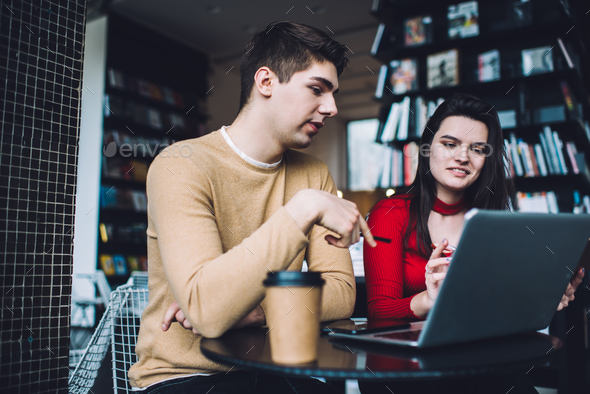 Smart employees coping with problem at work Stock Photo by GaudiLab
