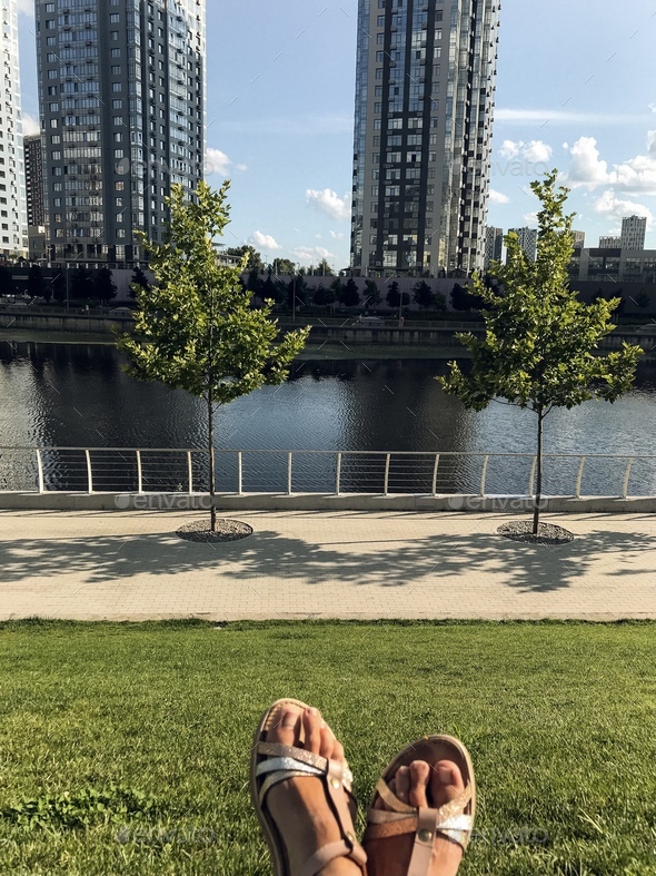 Summer relax leisure view. Urban modern river bank with glass buildings ...