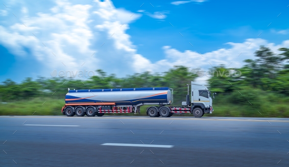 Gasoline tanker with fuel tanker truck shipping speed on high way road ...