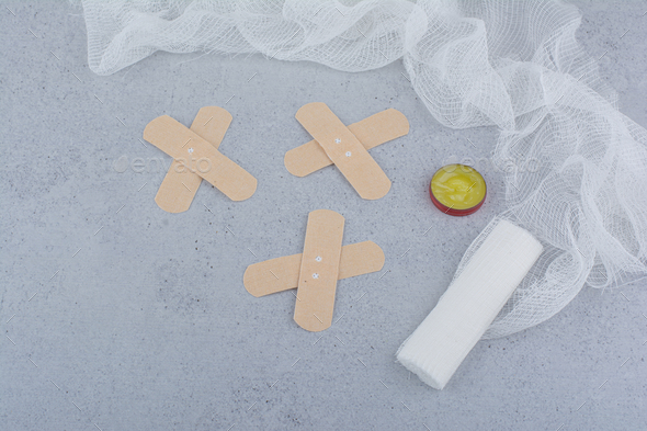 Band aid plaster strips, bandage and vaseline on marble surface Stock ...