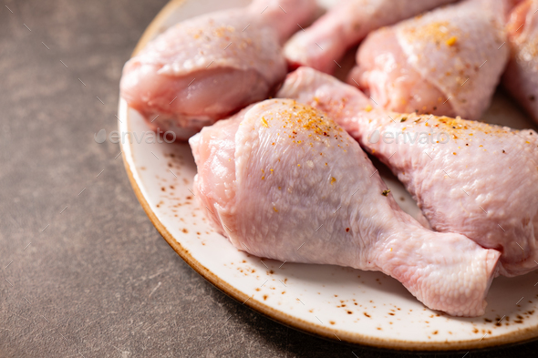 Preparation of fresh chicken legs for cooking Stock Photo by ff-photo