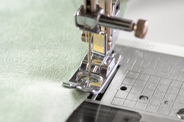 Modern Sewing Machine Presser Foot With Green Fabric And Thread ...