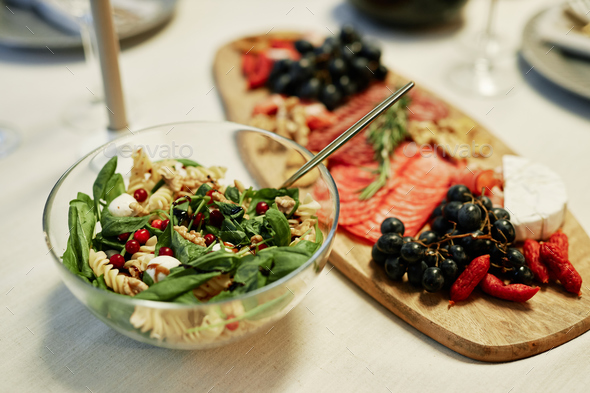 Appetizing homemade starter with green basil leaves and fusilli in ...
