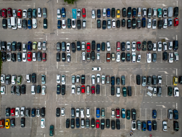 Drone's aerial view reveals a densely packed parking lot filled with ...