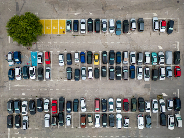 Drone's aerial view reveals a densely packed parking lot filled with ...