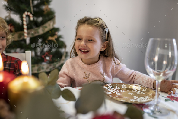 little girl at christmas dinner with family Stock Photo by ...