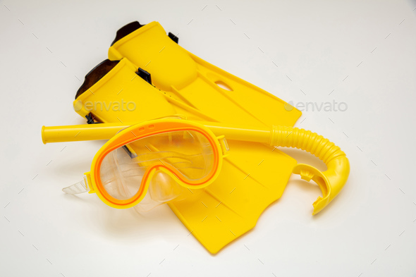 Yellow diving equipment, mask snorkel and flippers isolated on white ...