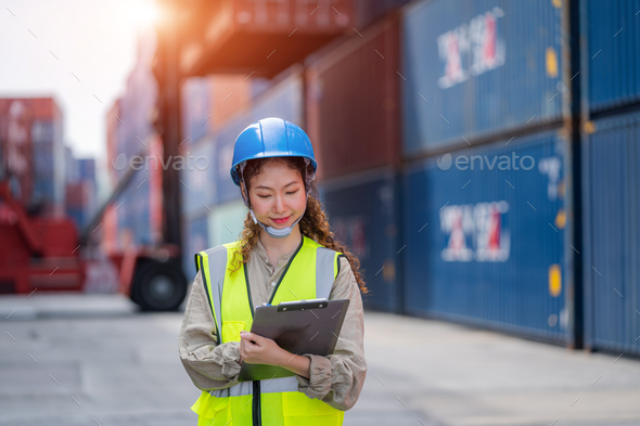 Container yard worker checking container at container yard warehouse ...
