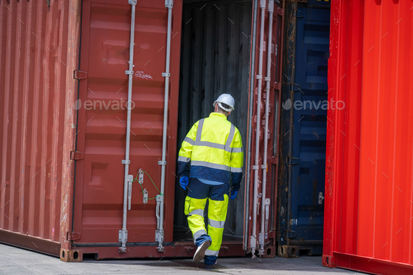Inspector checking container yard Organising stock to pack into ...