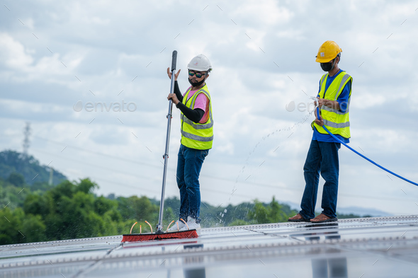 Technicians are cleaning solar panel,Clean solar panel in solar power ...