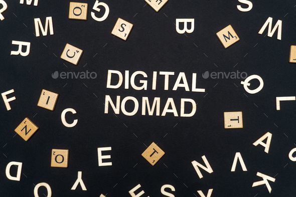 DIGITAL NOMAD word written on dark paper background. DIGITAL NOMAD text ...