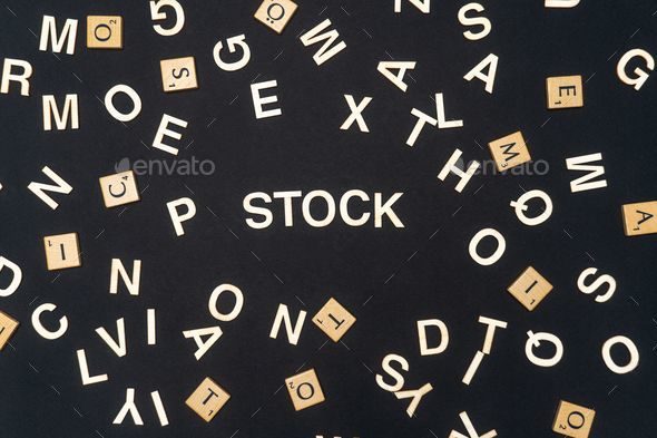 STOCK word written on dark paper background. STOCK text for your ...