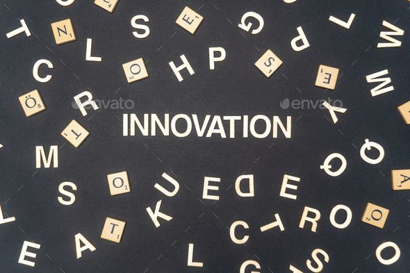 INNOVATION word written on dark paper background. INNOVATION text for ...