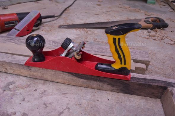 wood smoothing tool with wood craft background. Stock Photo by wirestock