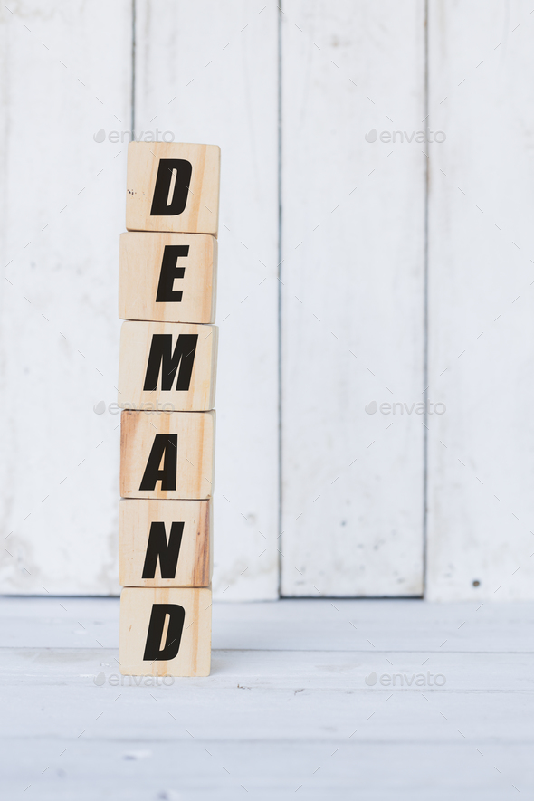 wooden cube, with the word demand with white wooden background Stock ...