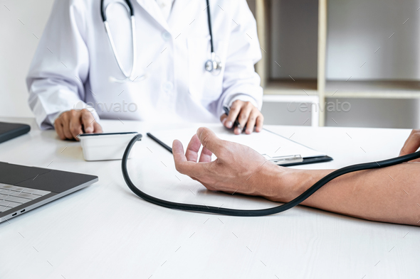Doctor being measuring examination patient and checking blood pr Stock ...