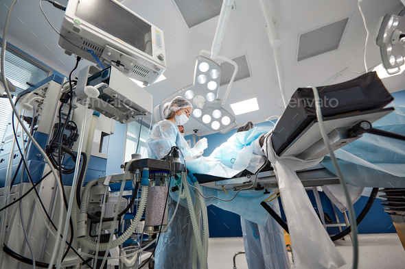 surgeon keeping track of vital functions of the body during cardiac ...