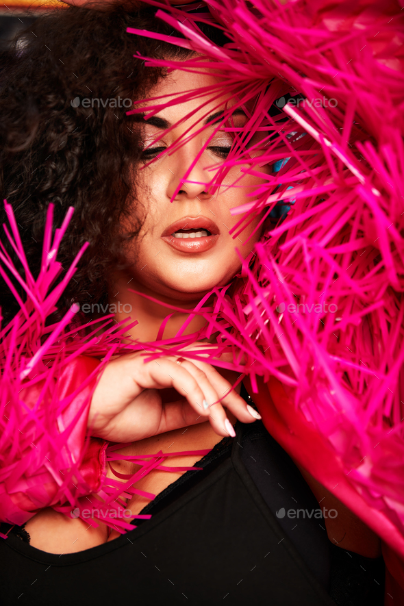 Female Plus size model posing in the studio, front face portrait, in ...