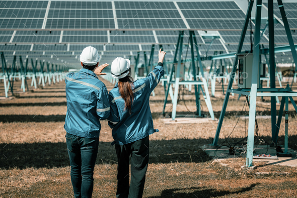 Solar design engineers assess arrays for alignment, stability, sunlight ...