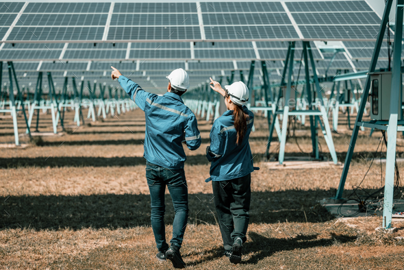 Solar design engineers assess arrays for alignment, stability, sunlight ...