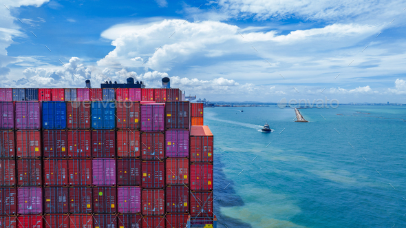 Stern of large cargo container ship import export container box on the ...