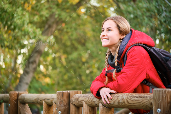 Smiling trekker contemplating views in the forest. Stock Photo by Ladanifer