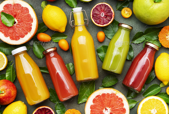 Summer fruit drinks. Citrus juices and smoothies in bottles Stock Photo ...