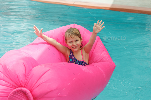 Happy little girl in the pool Stock Photo by Anna_Om | PhotoDune