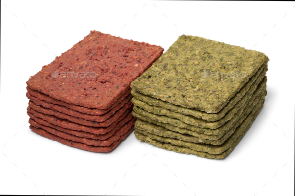 Heap of vegetable crackers seasoned with spinach and beet isolated on ...
