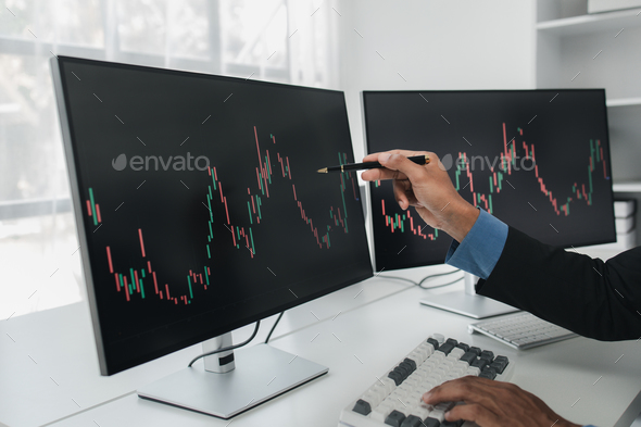 Stock investor with stock market graph screen, stock fluctuation ...