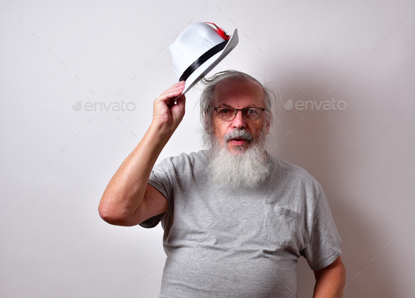 Old American male with a long white beard saluting with his hat Stock ...