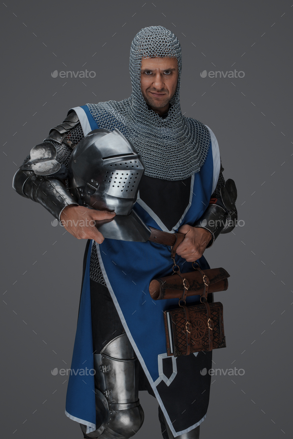 Regal protector, donning shining armor, blue surcoat Stock Photo by ...