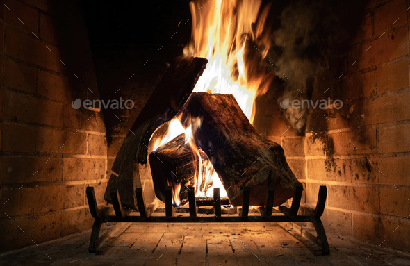 Fireplace close up, fire flame and burning wood log, warm home in ...