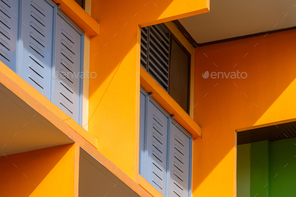 colorful shading fin concrete and steel windows on modern building wall ...