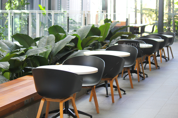 Modern table and chairs in a public space on college campus Stock Photo ...